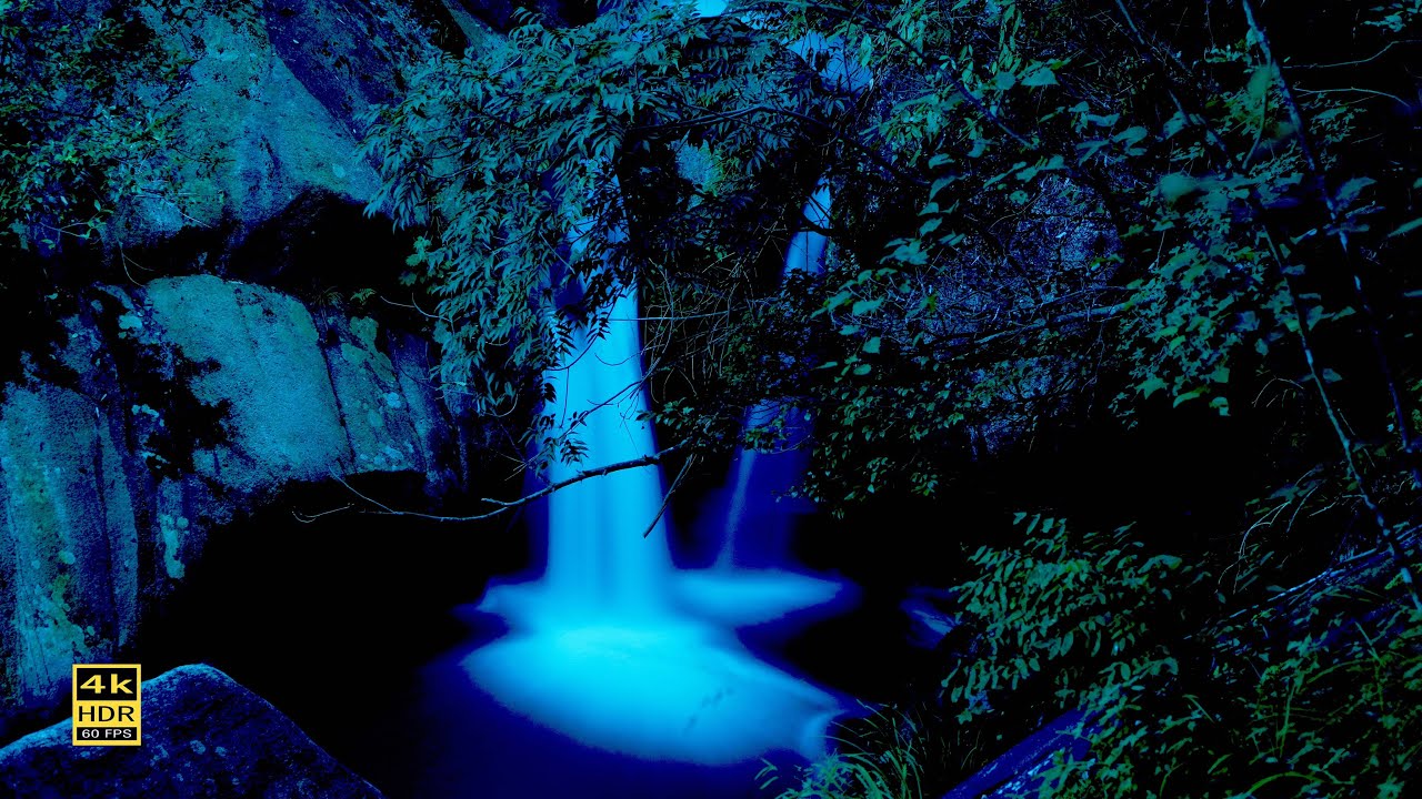 mesmerizing green-colored waterfall that beckons you into a realm of ...
