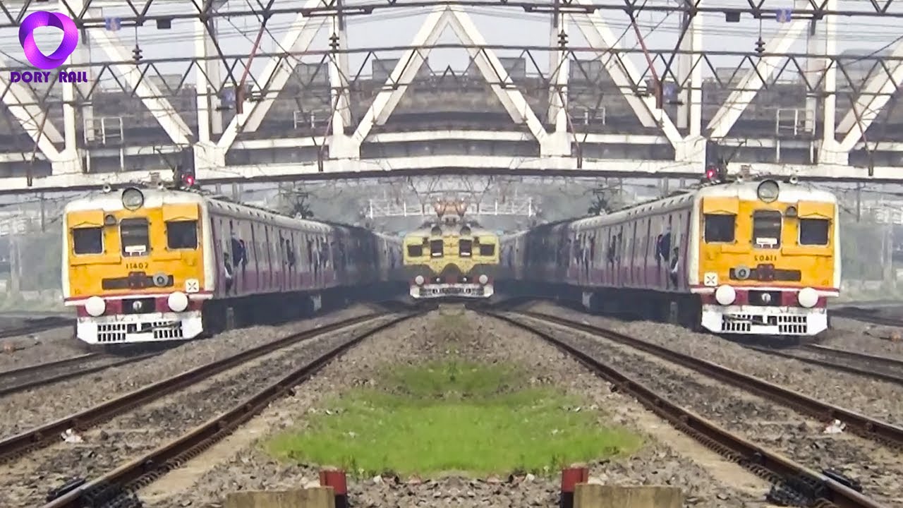 Green EMU parallel with yellow faced EMU - YouTube
