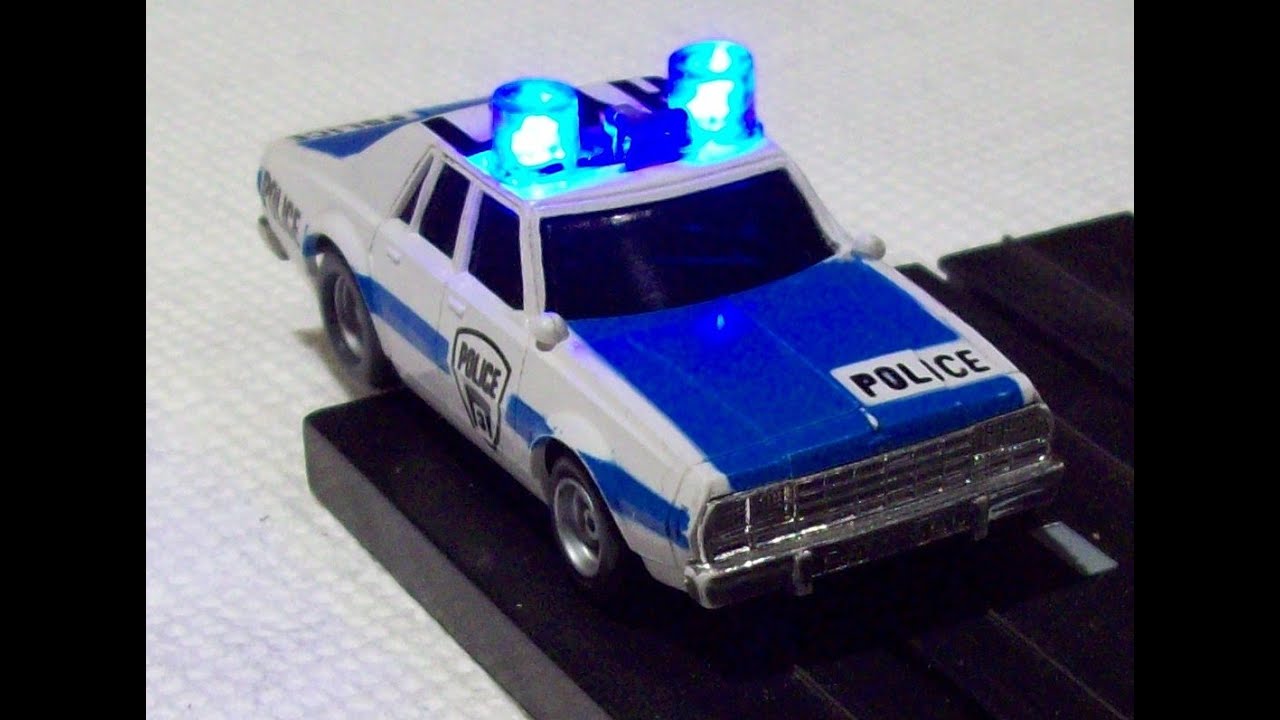 Aurora AFX Chevy Pursuit Police Slot Car with blue flashing LEDs - YouTube