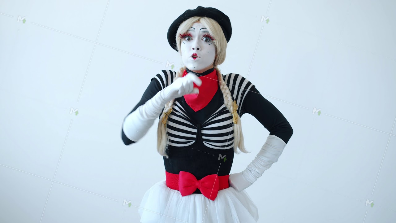 Cute female mime shushing touching lips with finger asking to keep ...