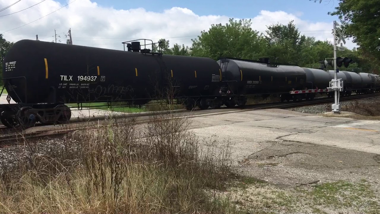 CSX 734 leads eastbound mixed freight with DPU - YouTube