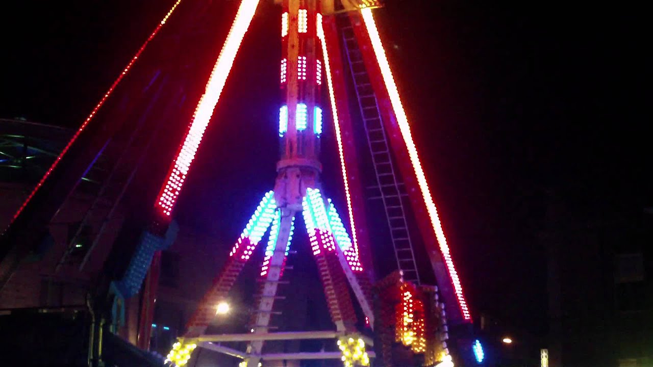 city hall sheffield fountains night time view and the fair ground ride ...