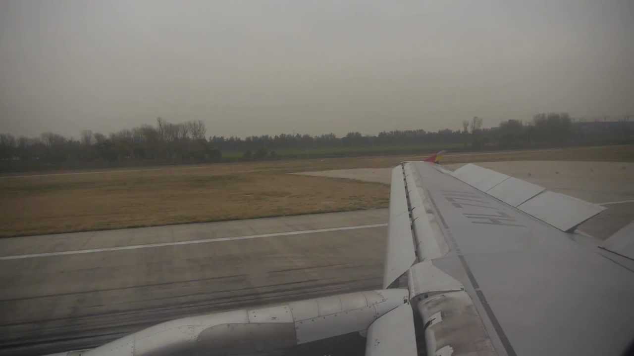 [Full HD] Wing view of Asiana Airlines A321 landing at Beijing Capital ...