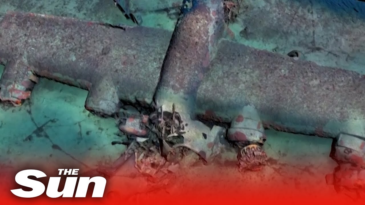 WW2 remains recovered from sunken American bomber plane - YouTube