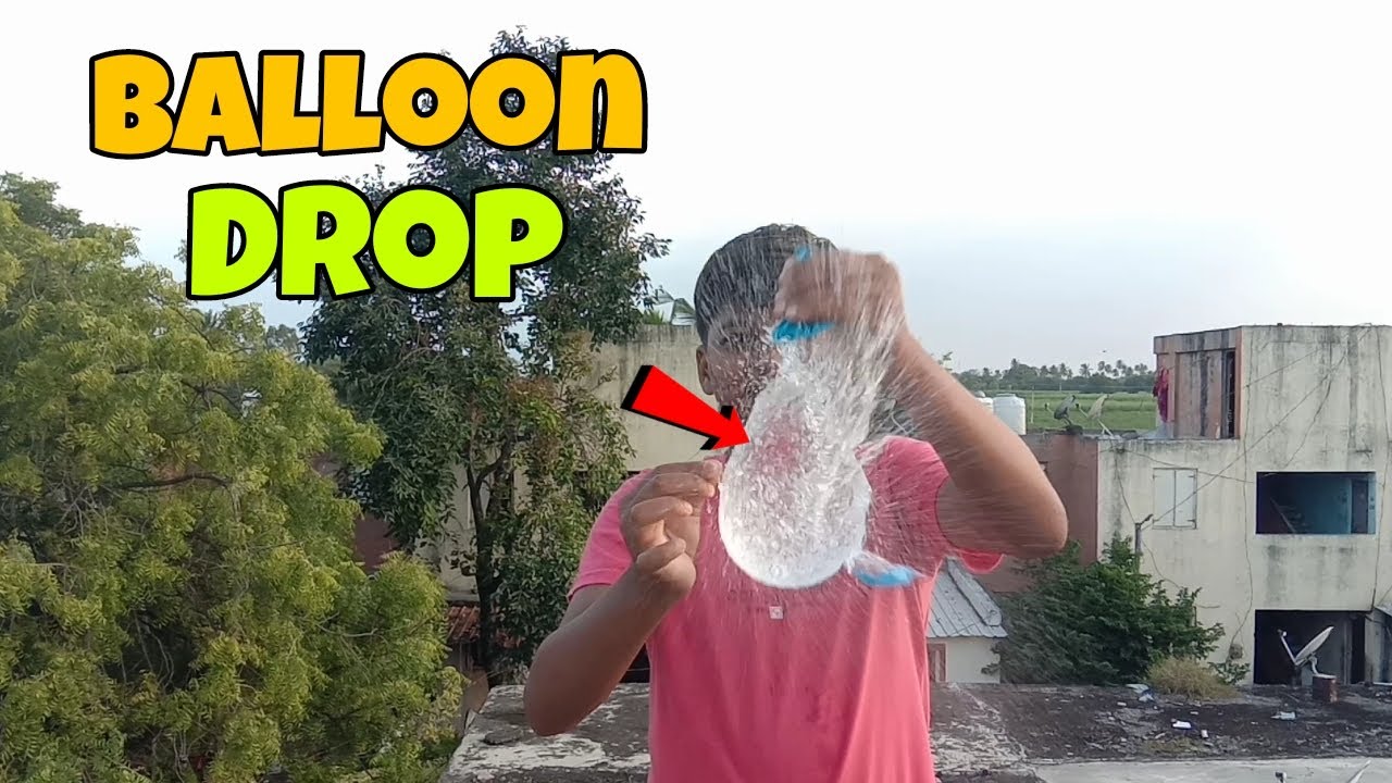 Balloon drops slow motion video - YouTube