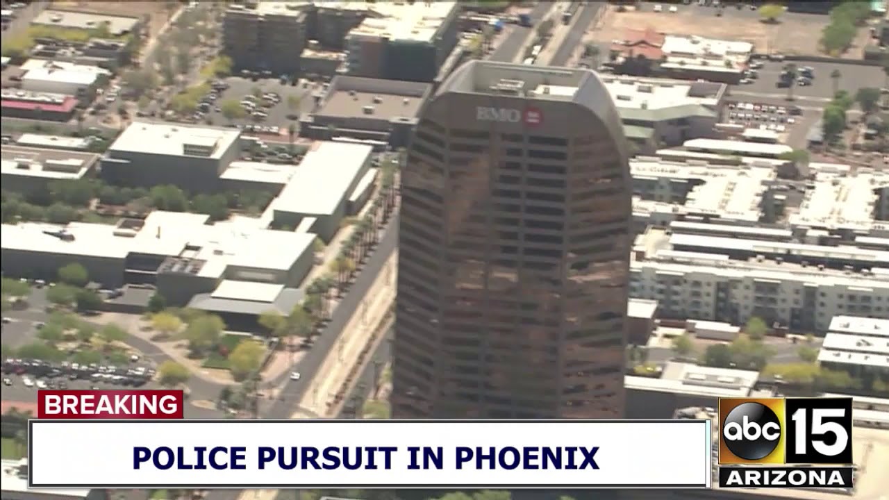 LIVE: Police pursuit suspect hops curb and drives on light-rail tracks ...