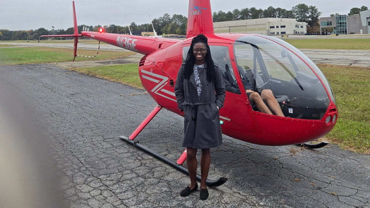 Rashida Strober flying in a helicopter over Atlanta - YouTube