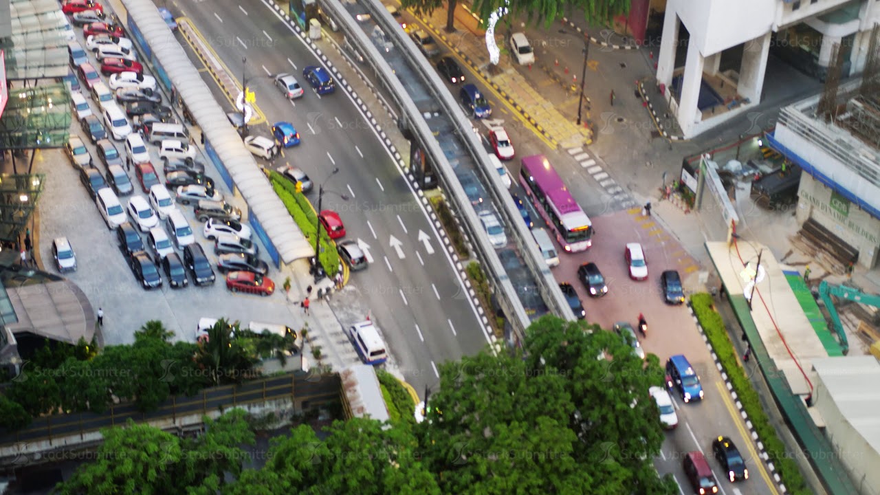 Camera rotating above crossroads in the city, cars drive through the ...