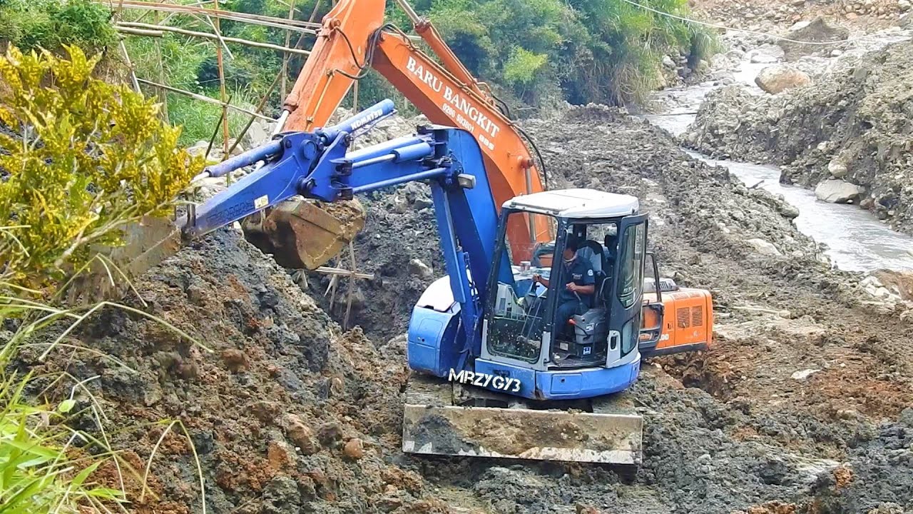 Excavators Digging Bridge Foundation On The River - YouTube