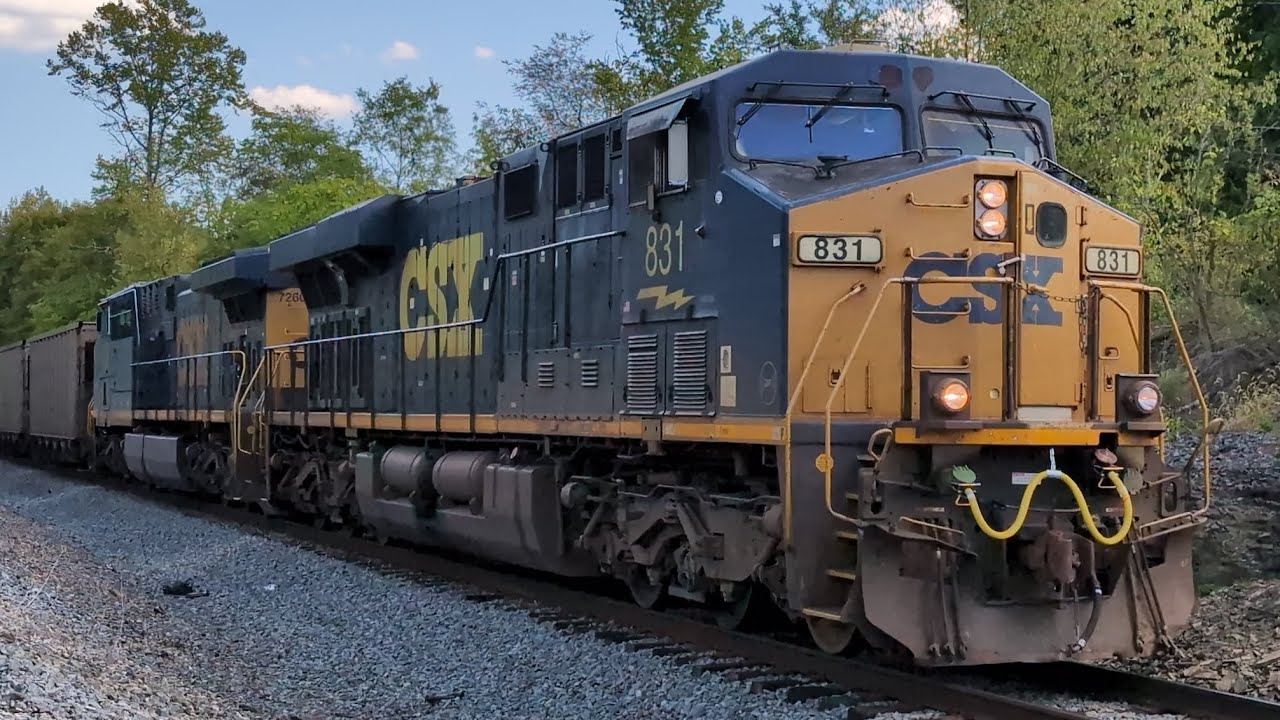 CSX 831 Leads Empties Through Besco - YouTube