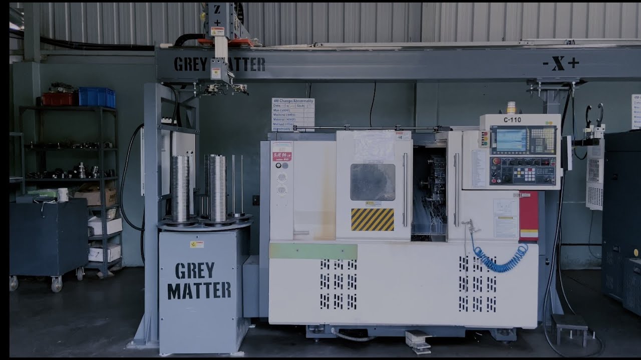 Gantry robot on ace Micromatic cnc turning machine with rotary stacker ...