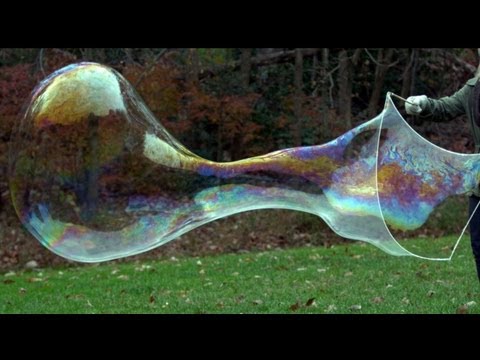 big Bubbles Bursting in Slow Motion
