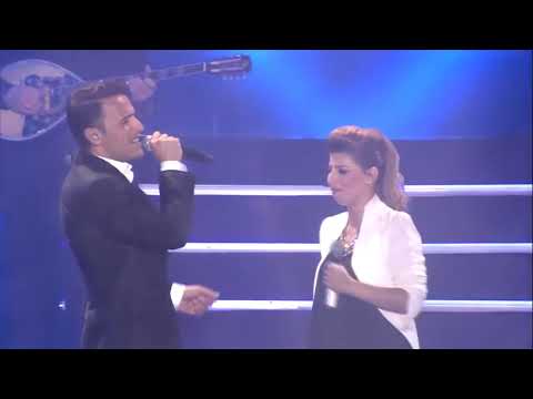 Greek singer Nikos Vertis in Israel performing -Emeis oi dyo tairiazoume- with Sarit Hadad