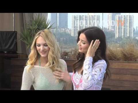 Miranda Kerr and Candice Swanepoel debut new swimsuits from Victoria's Secret.