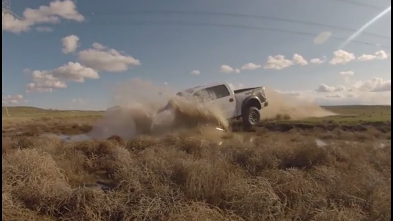 Brand new 2014 F-150 raptor mudding and jumping - YouTube
