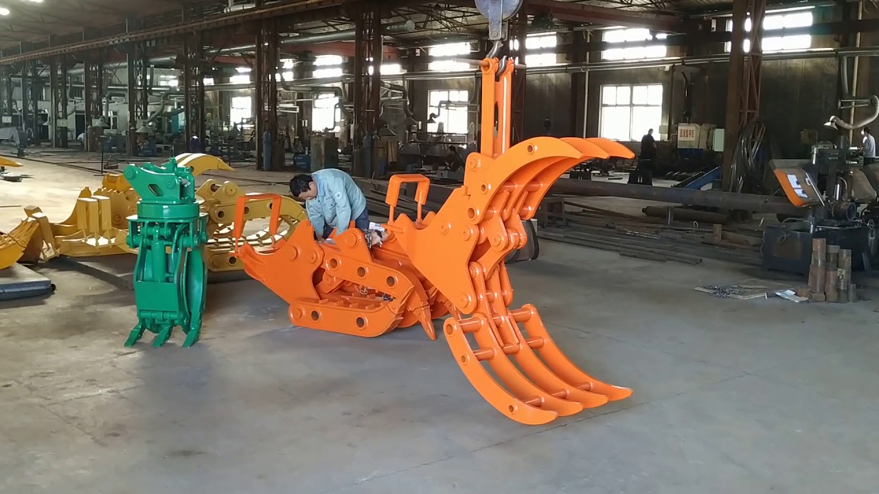 Excavator mounted steel grab scrap grabber used for recycling - YouTube