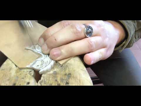 Creation of bouzouki decoration made by white sea-shell