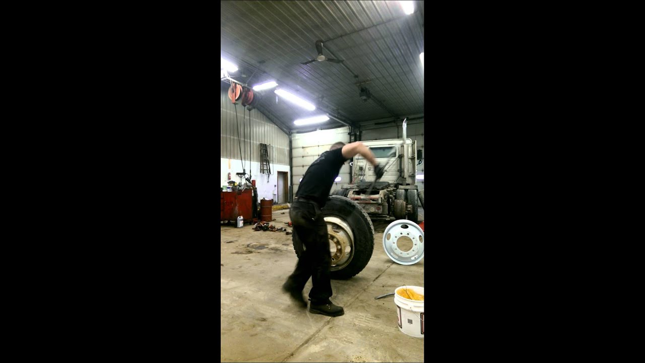 Changing semi truck tire - YouTube