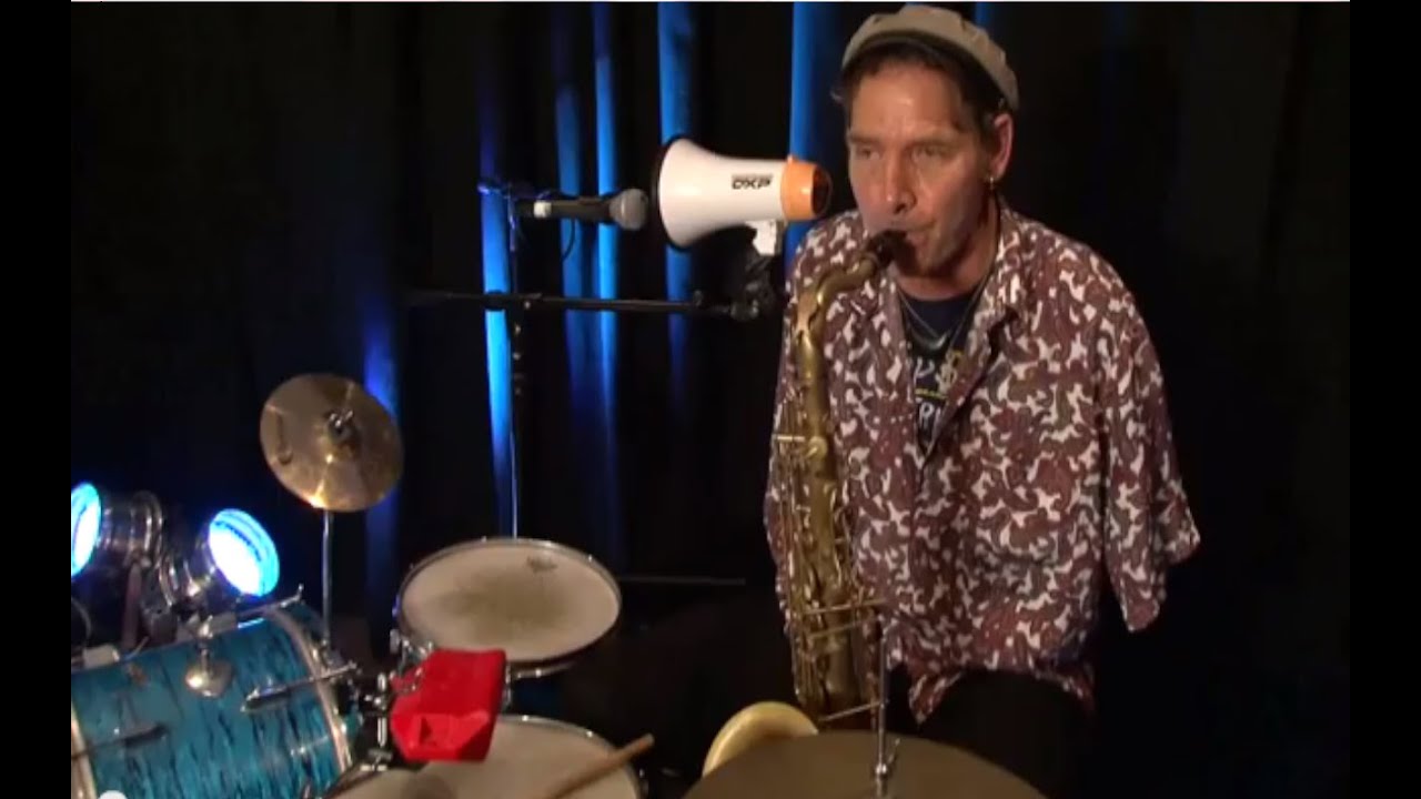 Neill Duncan plays the one-handed saxophone and drums - YouTube