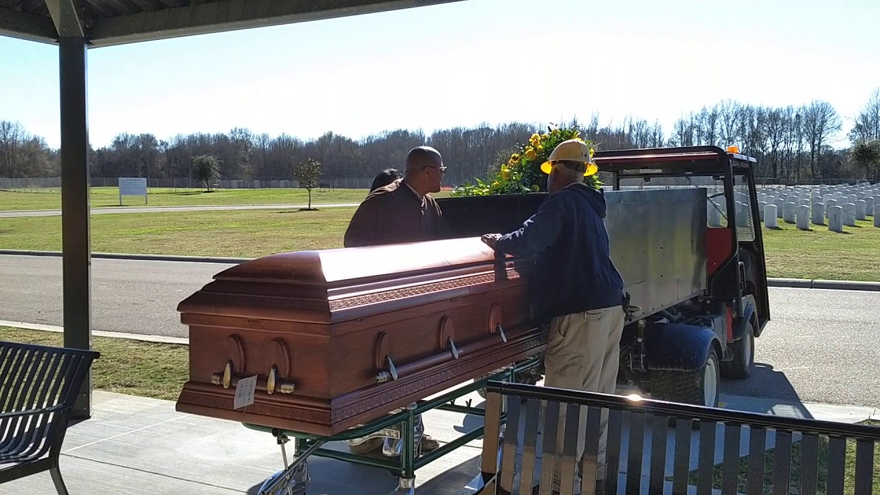 Loading my dad's coffin into the truck to drive it to the burial plot ...