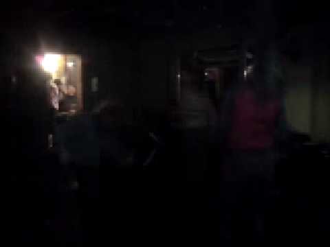 drunk man head banging to status quo