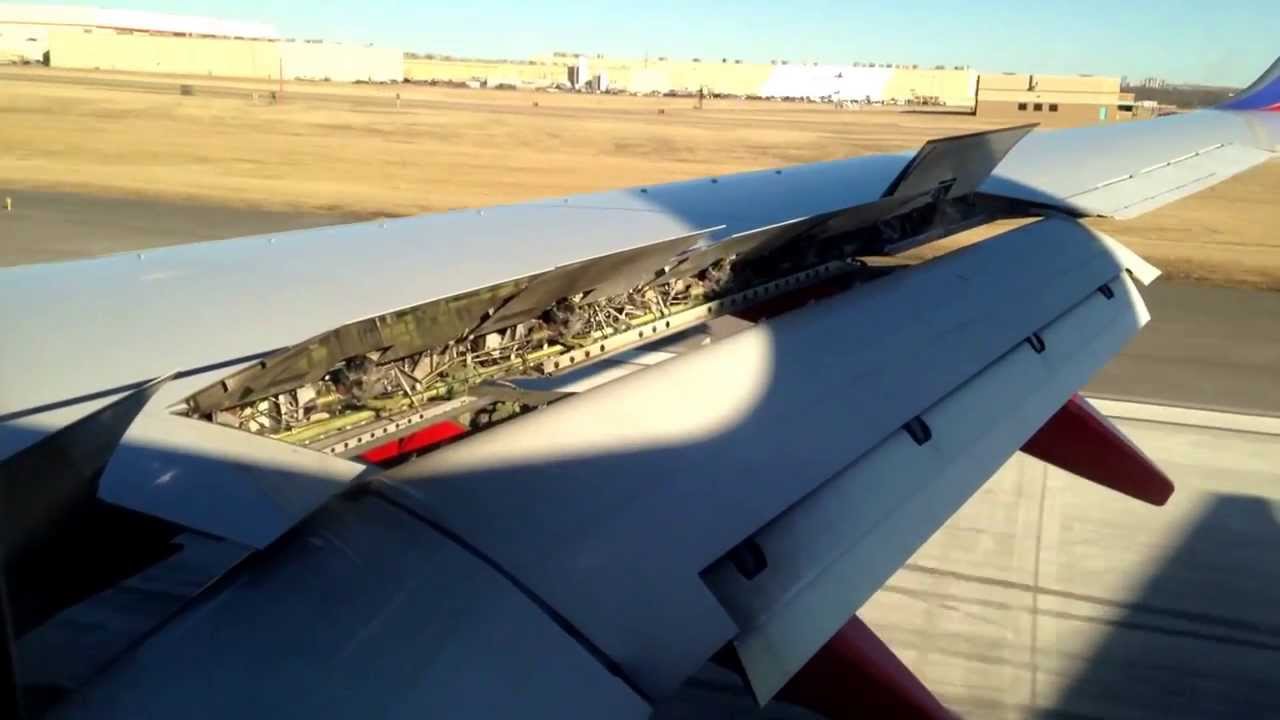 Boeing 737 Series 700 Landing - Over Right Wing - Flaps and Reverse ...