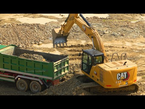 Cat 323GC And Cat 320 Excavator Digging Stone Loading Into Dump Truck