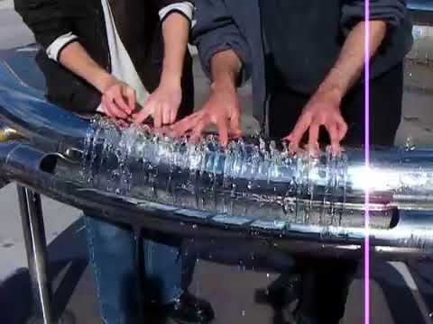 Two people playing hydraulophone (water pipe organ flute) - YouTube