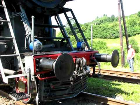 Steam locomotive class 477 "Parrot" aproaching carriages at Podolínec ...