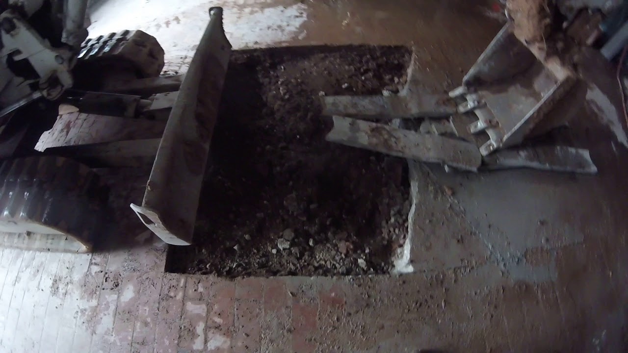 bobcat 325 excavating underground car lift - YouTube