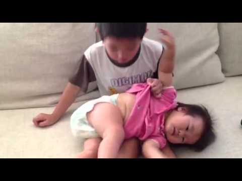 Blowing raspberries on Emerie's Belly