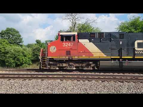 CN 3247, 2756 roll an Eastbound train with BNSF, BN covered hopper through Michigan - YouTube
