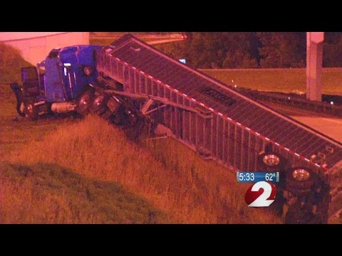 Semi forced off interstate, gets stuck on hill