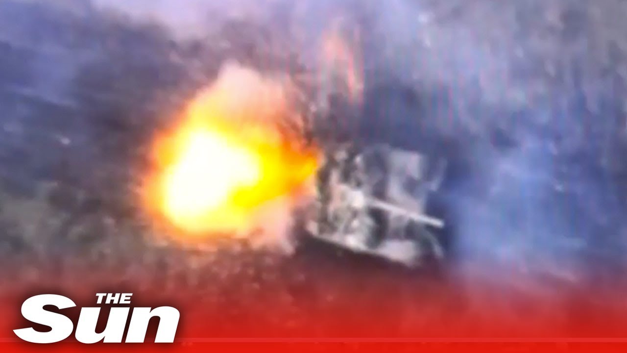 Ukrainian kamikaze drone crashes into Russian tank in huge explosion ...