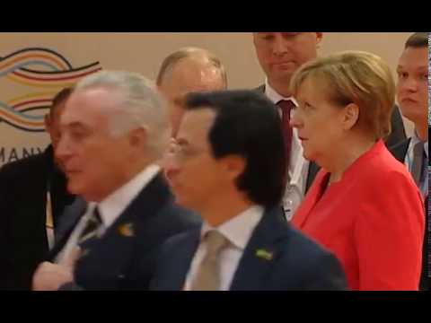 Merkel appears to roll her eyes at Putin