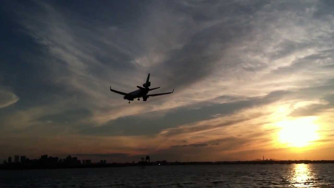 FedEx landing at Logan at sunset - YouTube
