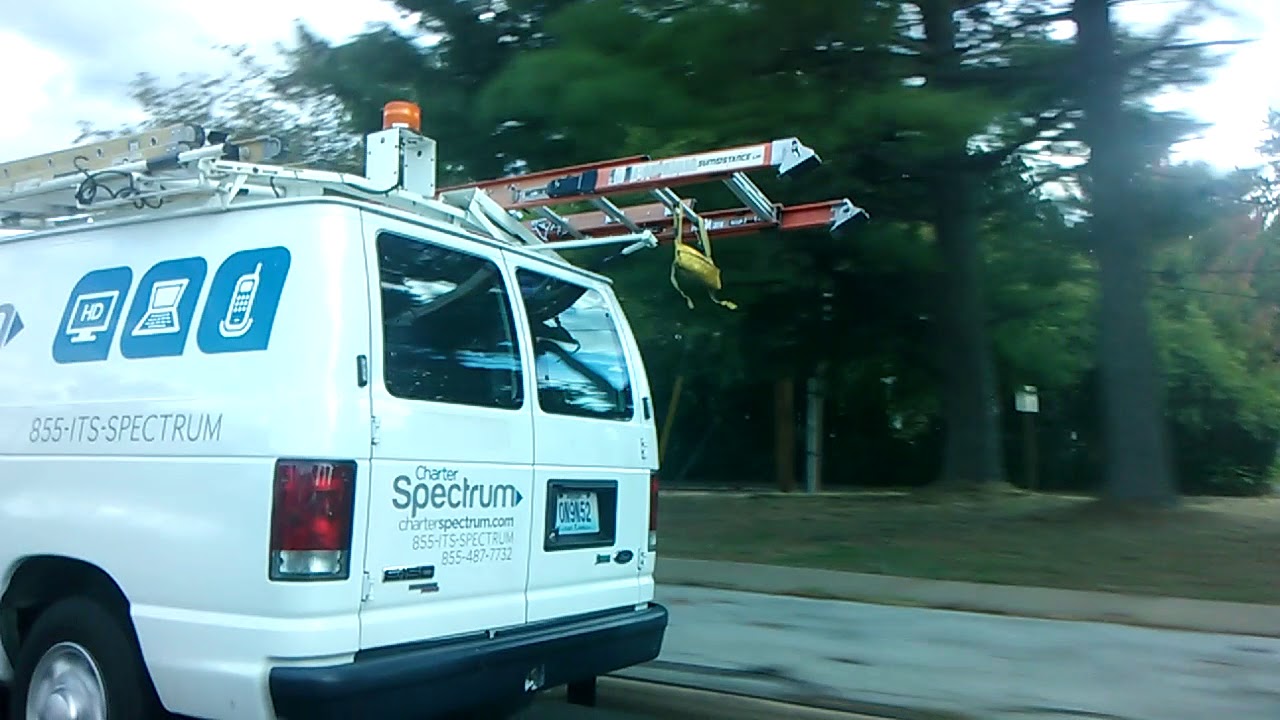 Charter Spectrum utility van heading to North Florissant Road to help a ...
