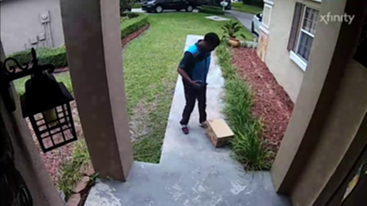 Amazon driver gives package delivery a swift kick - YouTube