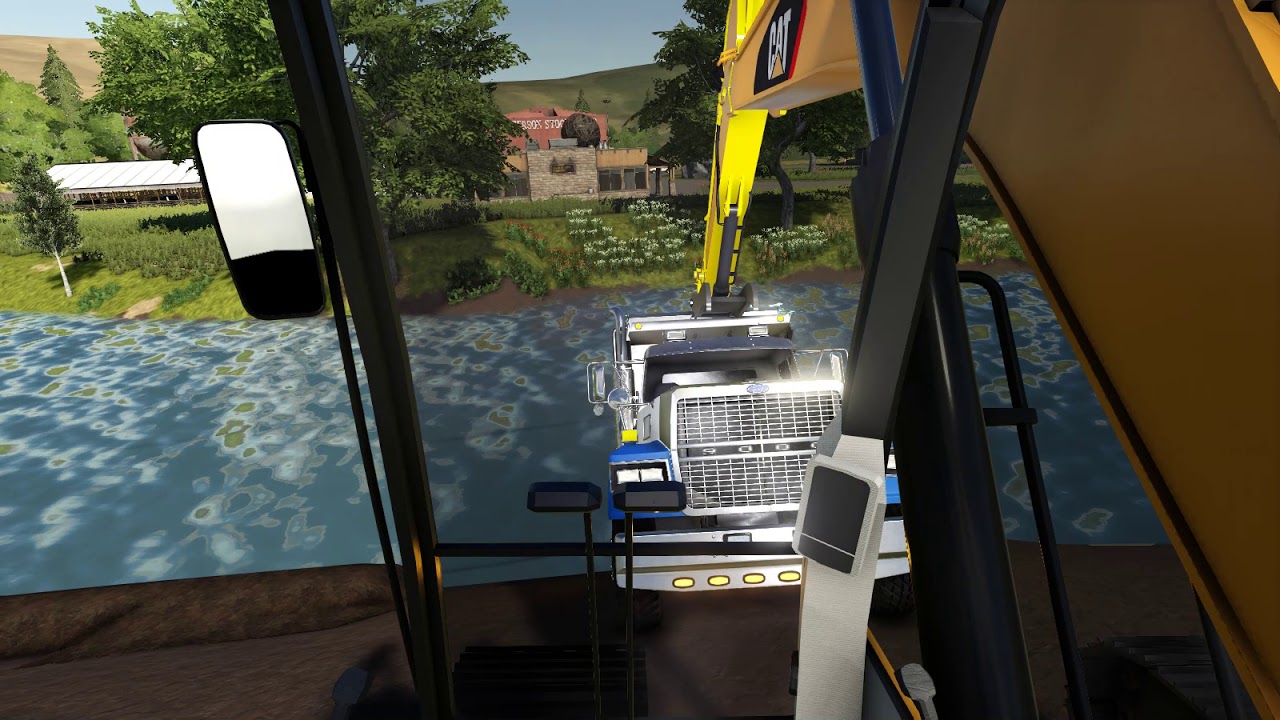 Fs19 Cat 325D pulling a loaded triaxle up a hill - YouTube