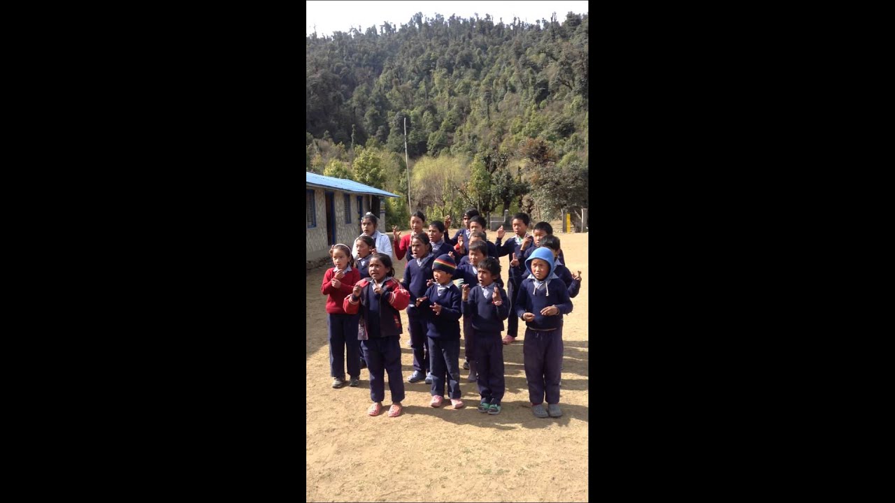 Nepali kids sing "One Light One Sun by Raffi - YouTube