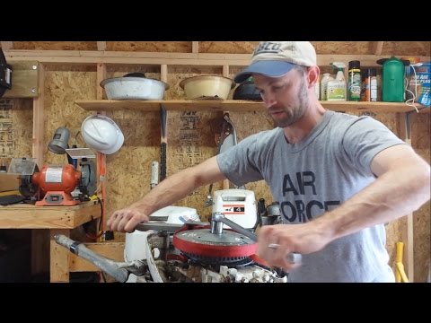 How to Remove a Flywheel on a Johnson / Evinrude / OMC Outboard Motor ...