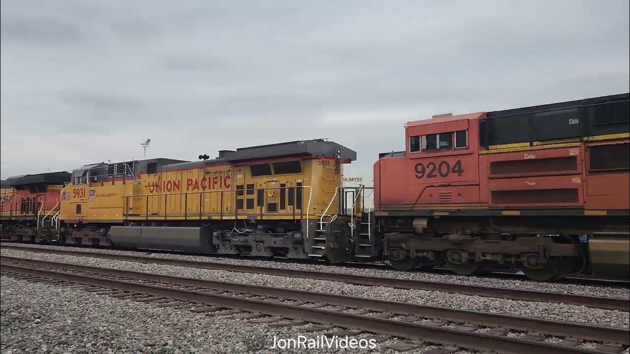 11/26/24 Pre: WB BNSF S train passes Los Nietos/SFS crossings with UP 5931 small flag up front ...