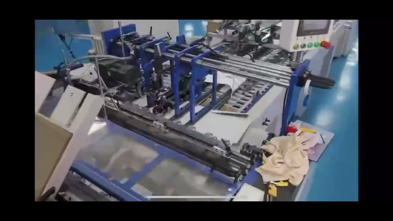 Automatic bags folding machine - YouTube