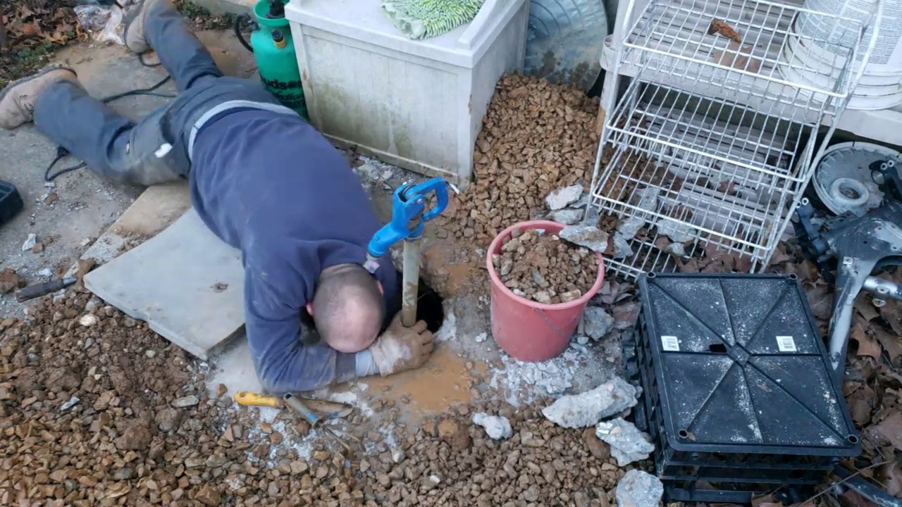 Redneck tears out concrete and hand digs to repair a water hydrant ...