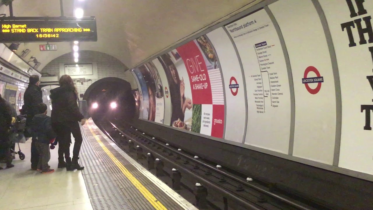 London Underground Northern Line train arrives at Leicester Square ...