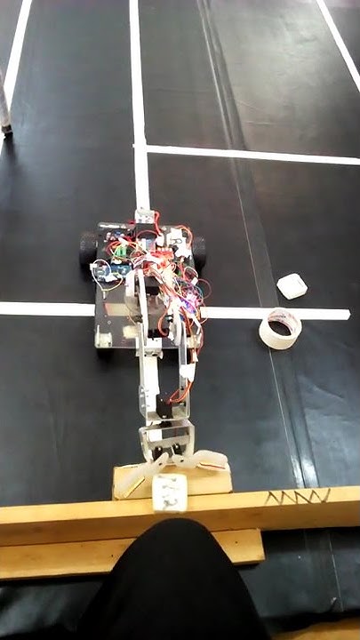 robot and robotic arm:training a robot to follow a line and pick item ...