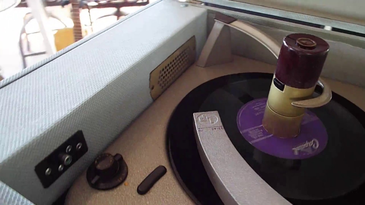 Vintage Columbia record player playing a stack of 45 RPM, 7 inch ...