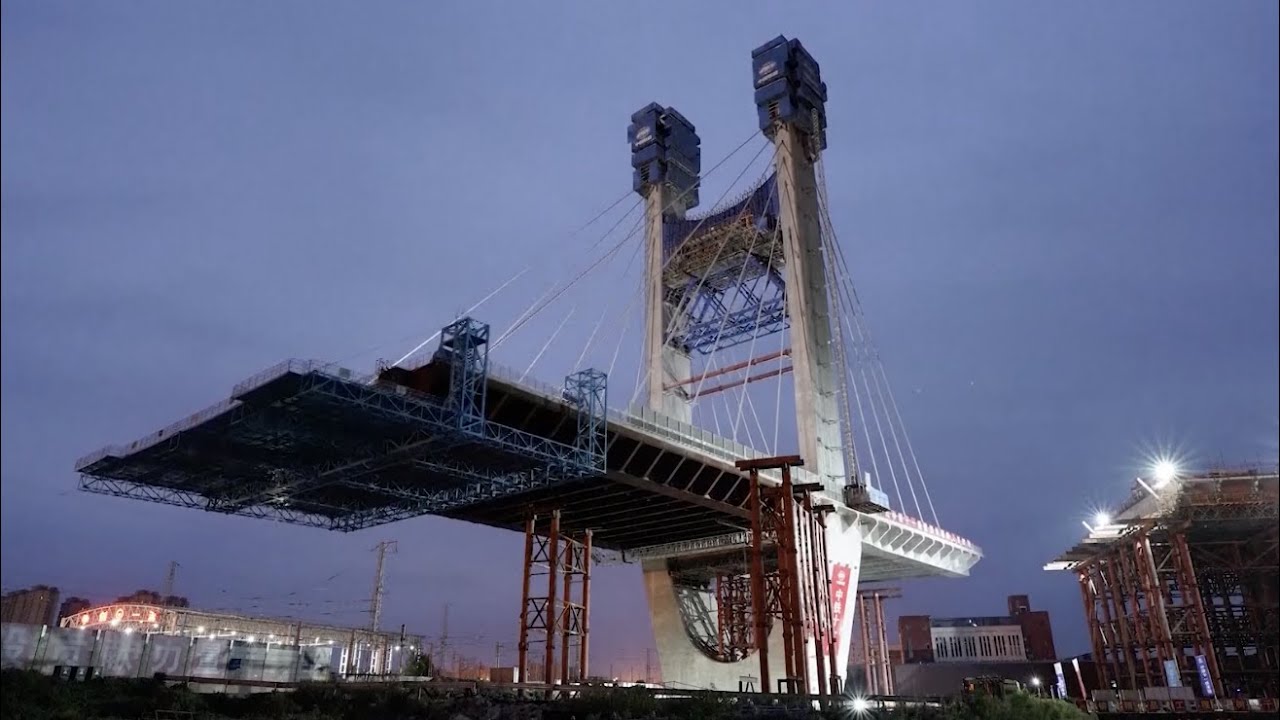 Massive bridge tower in central China completes record-setting rotation ...