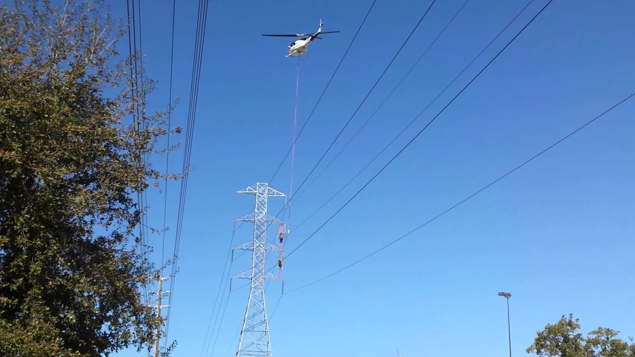 High voltage power line raised by helicopter - YouTube