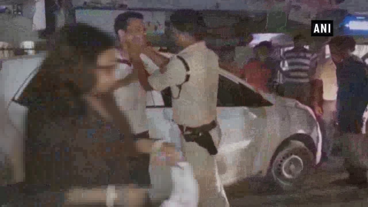 Policeman slaps man over car parking - YouTube